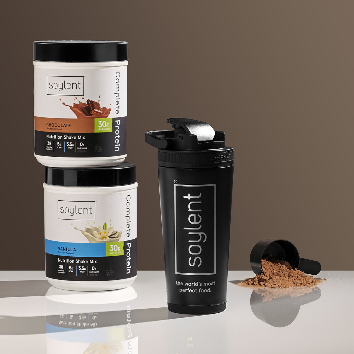 Soylent complete protein powder bundle next to blender bottle.